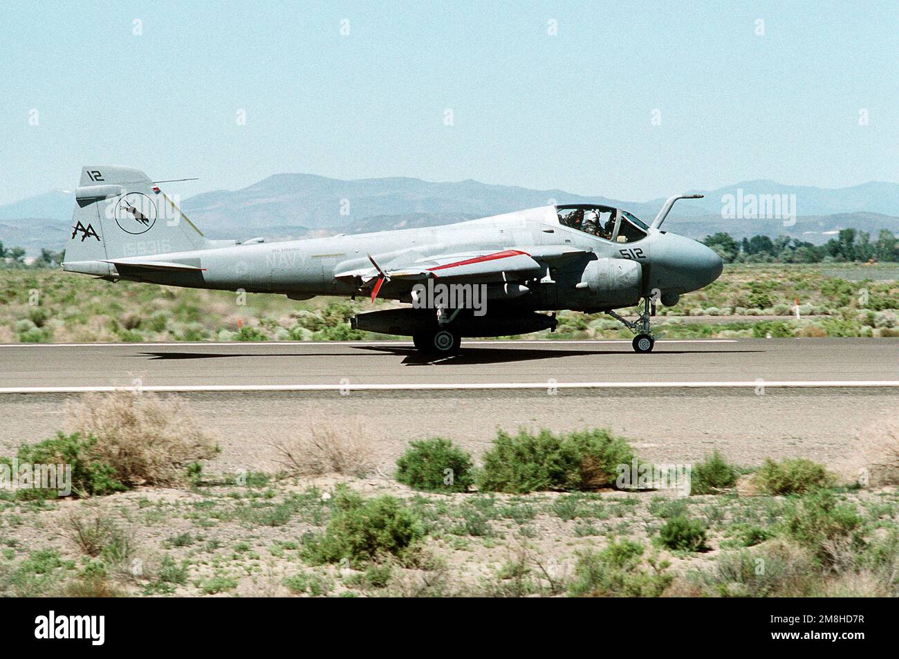 An Attack Squadron 65 (VA-65 ) A-6E Intruder aircraft taxis on the ...