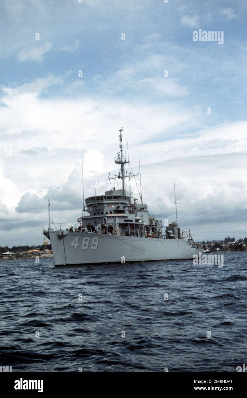 A port bow view of the ocean minesweeper USS GALLANT (MSO-489) anchored ...