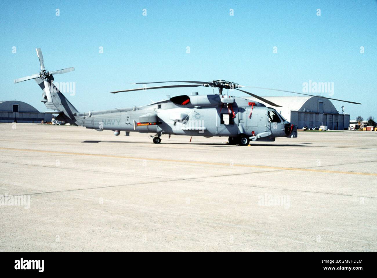 A right side view of a SH-60F Sea Hawk helicopter parked on the flight ...