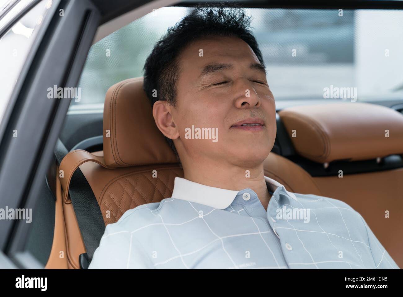 Business man in the car to rest Stock Photo - Alamy