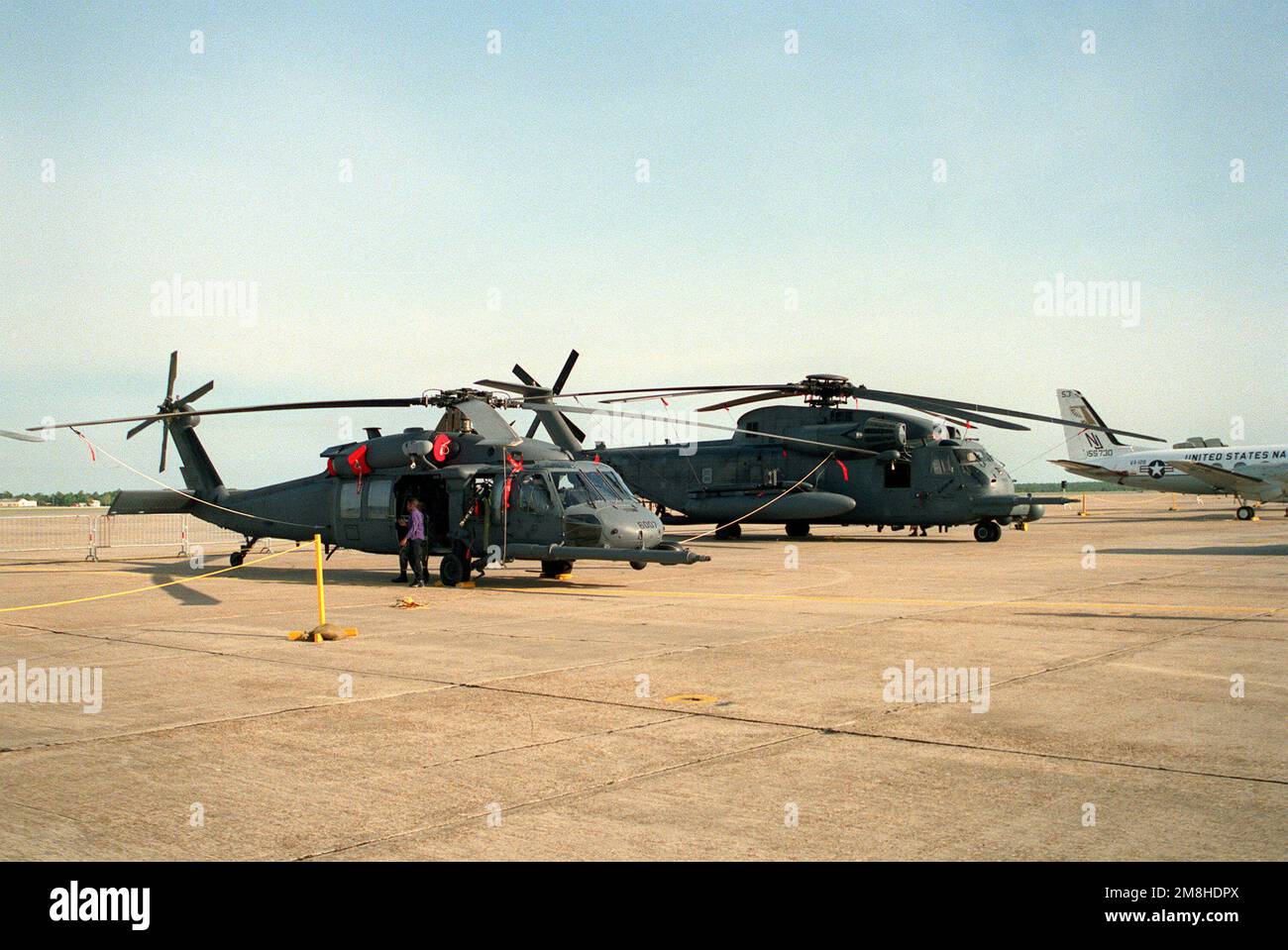 A right side view of an Air Force MH-60G pave Hawk helicopter and an MH ...
