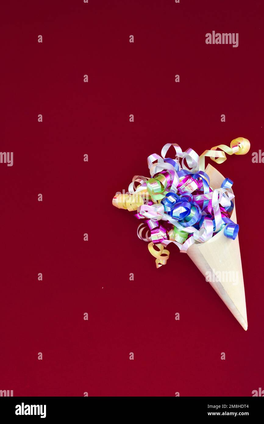 Paper cone with colorful party streamers Viva Magenta background Stock ...
