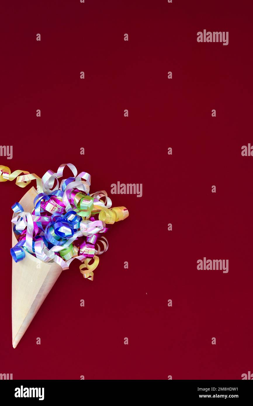 Paper cone with colorful party streamers Viva Magenta background Stock ...