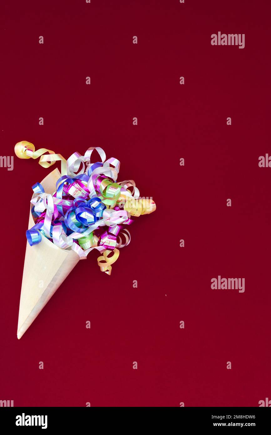 Paper cone with colorful party streamers Viva Magenta background Stock ...