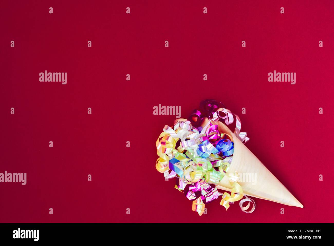 Paper cone with colorful party streamers Viva Magenta background Stock ...