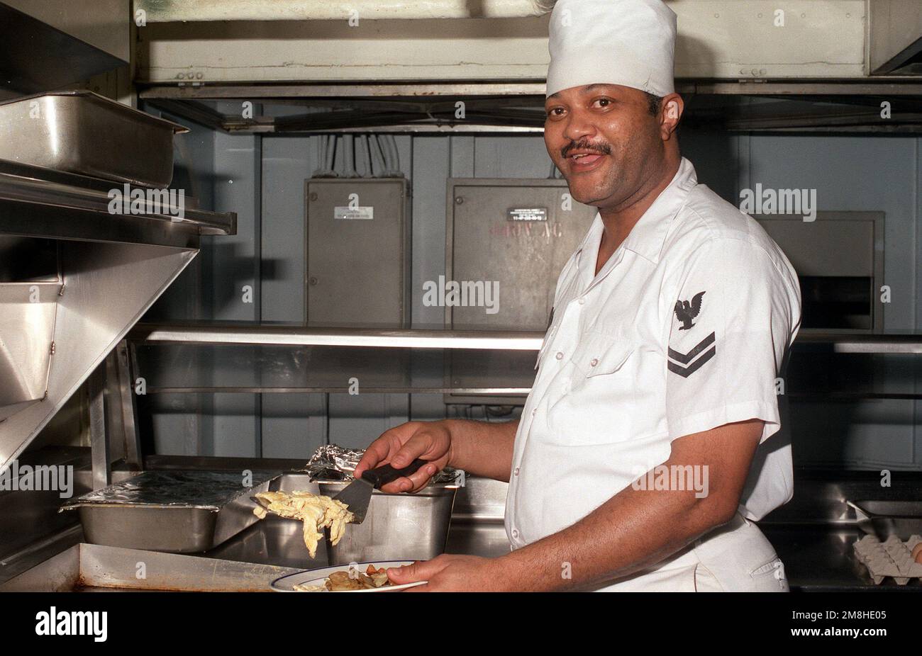 Mess Management SPECIALIST 2nd Class Glaston J. Copper Jr. cooks an ...