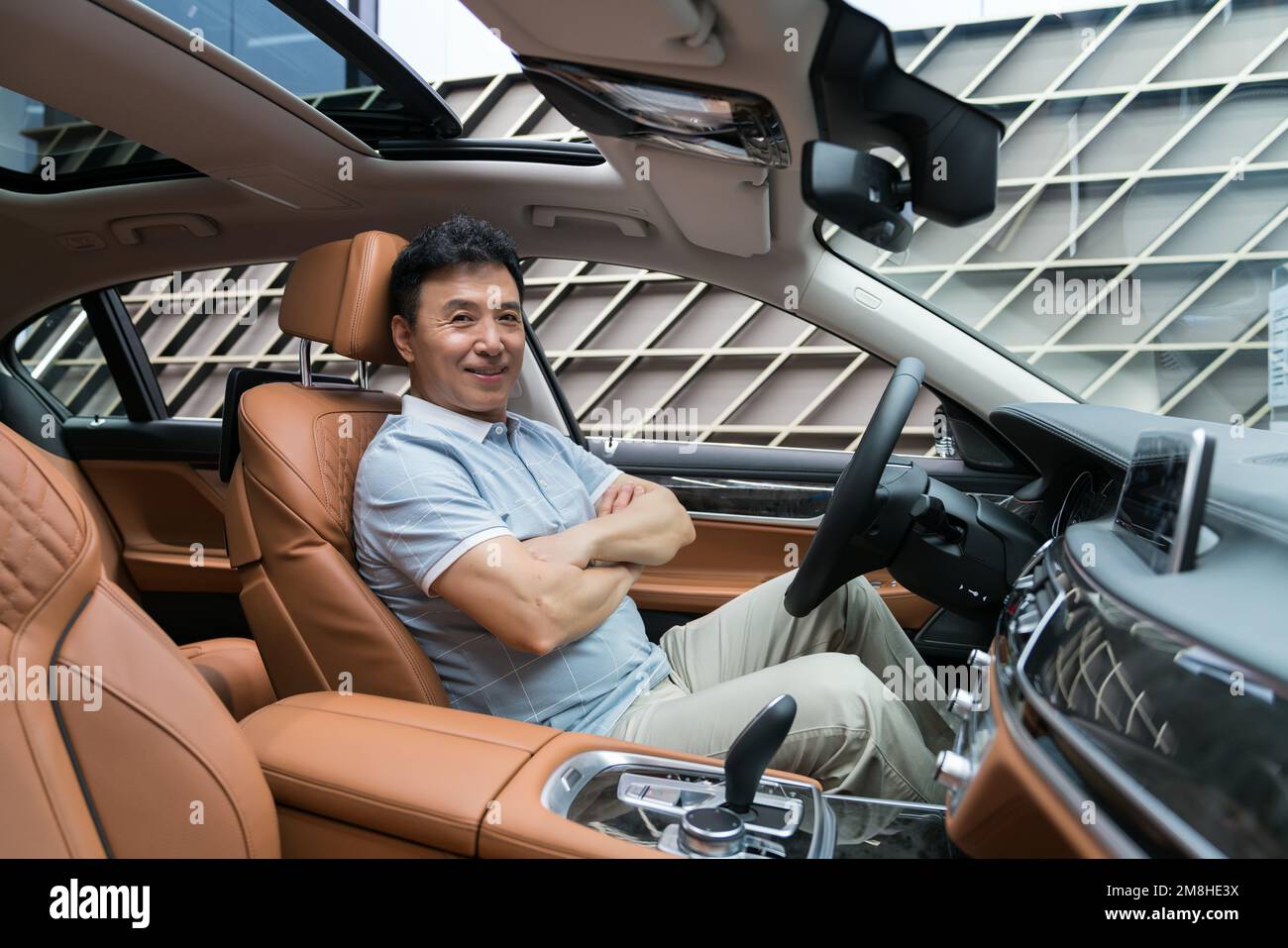 The old man test drive car Stock Photo - Alamy