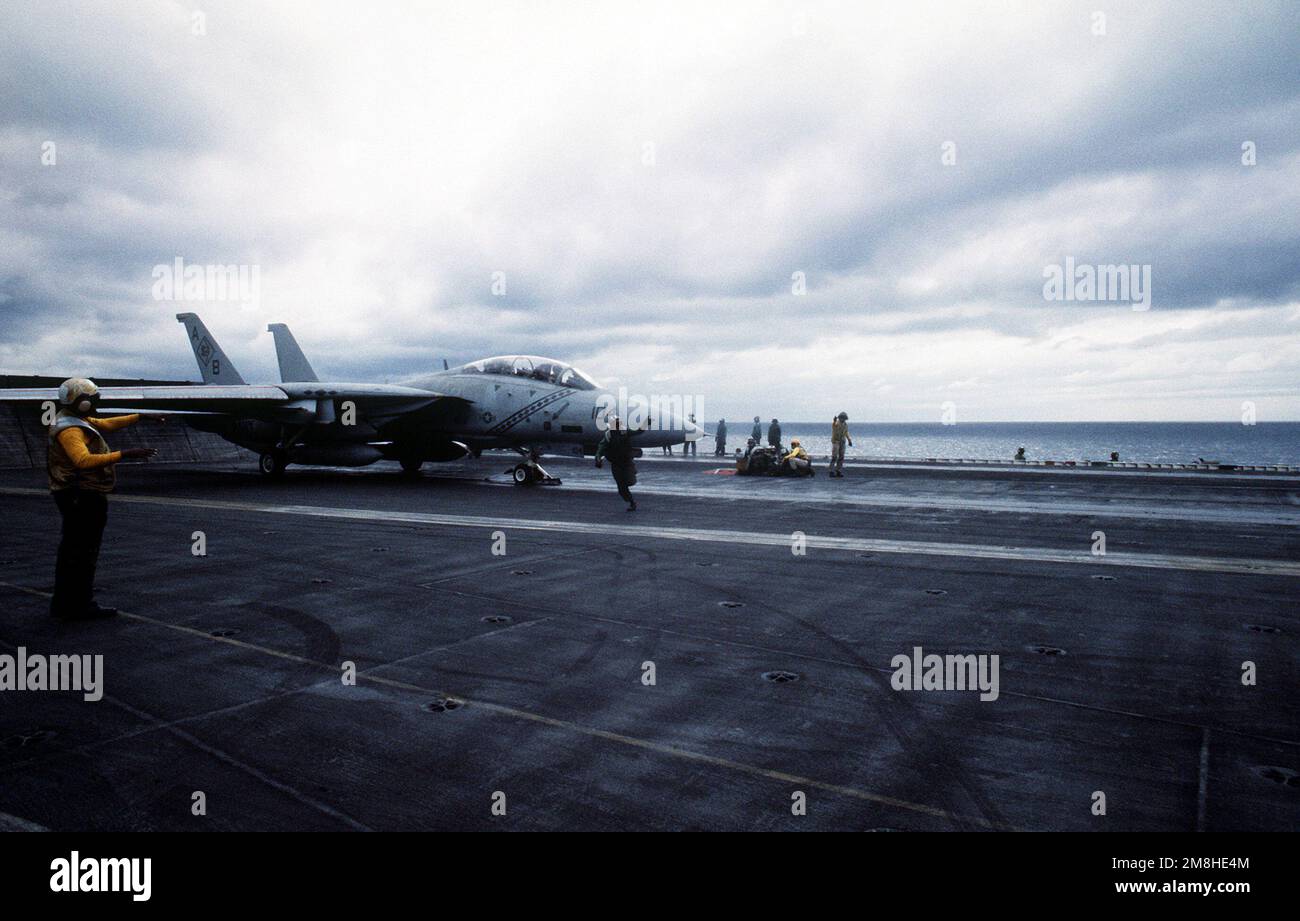 Catapult crewmen prepare to launch a Fighter Squadron 102 (VF-102) F ...