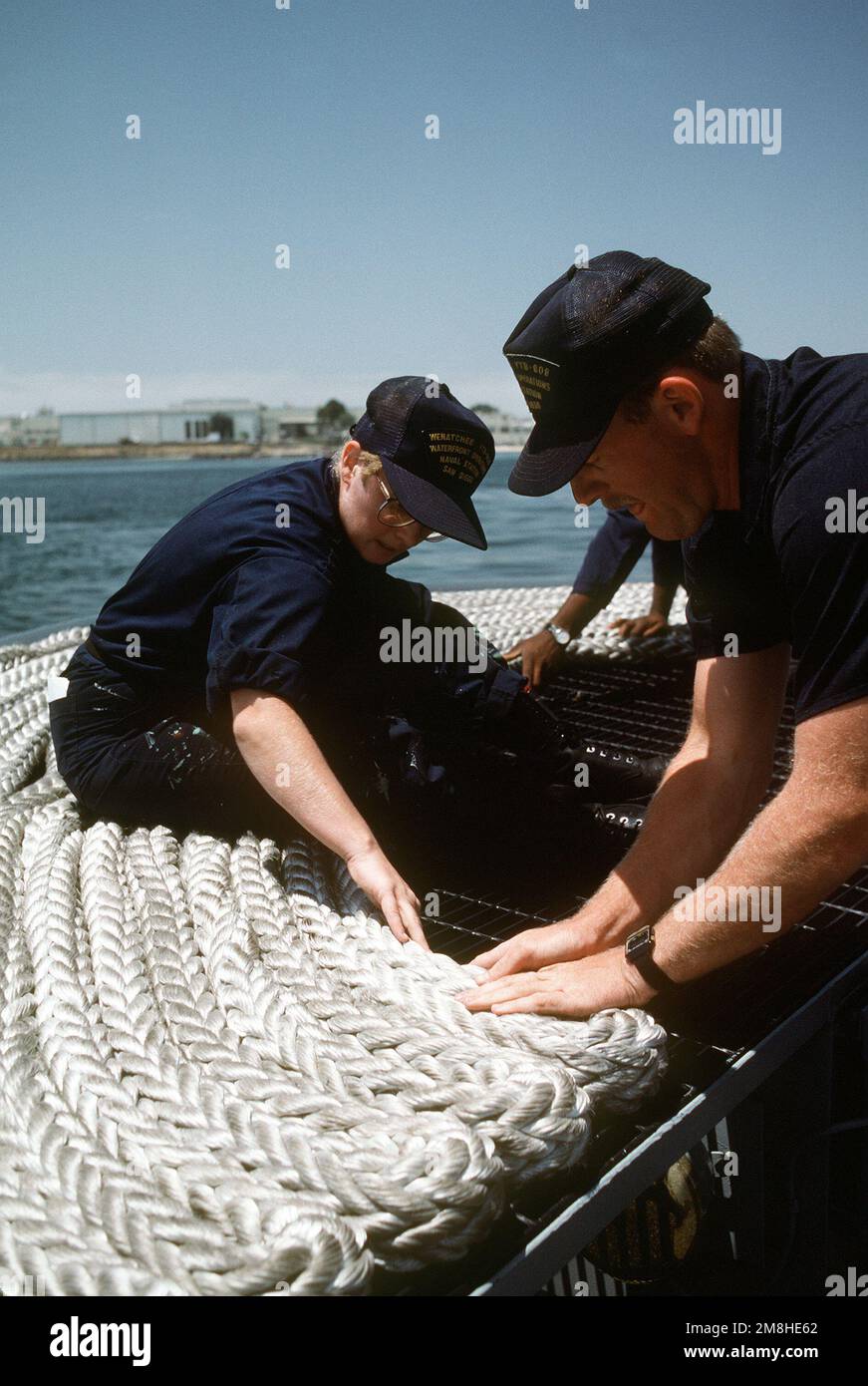 Fireman Apprentice Sara Heath and fellow crew members lay out line ...