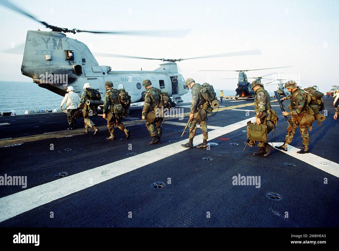 Marines board a Marine Medium Helicopter Squadron 365 (HMM-365) CH-46E ...