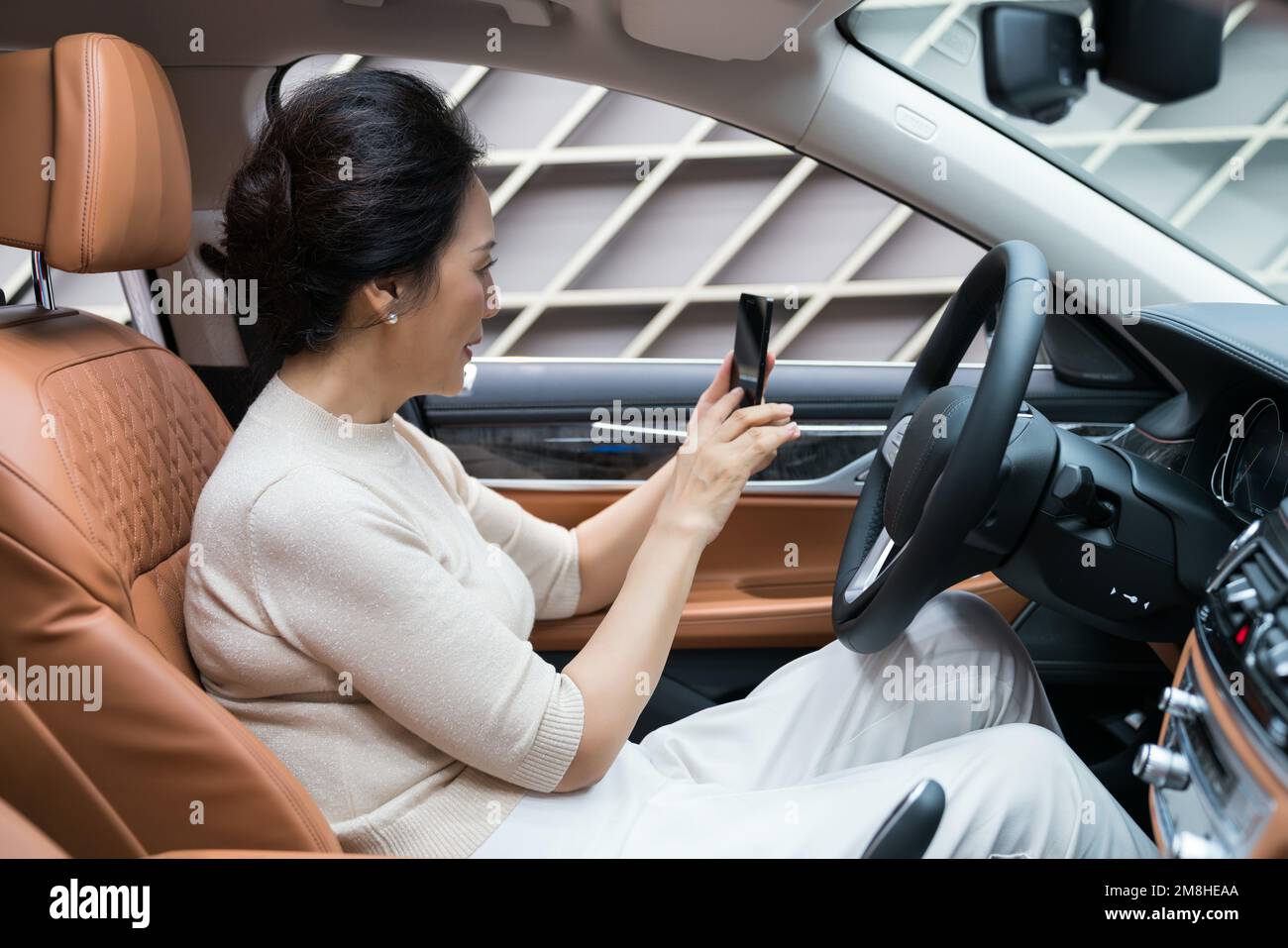 Lady carrying a mobile phone hi-res stock photography and images - Alamy
