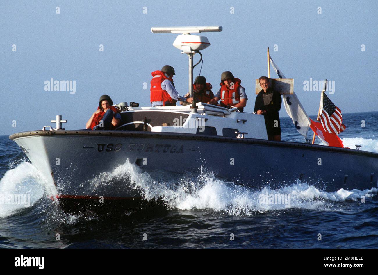 A motor whaleboat from the dock landing ship USS TORTUGA (LSD-46 ...