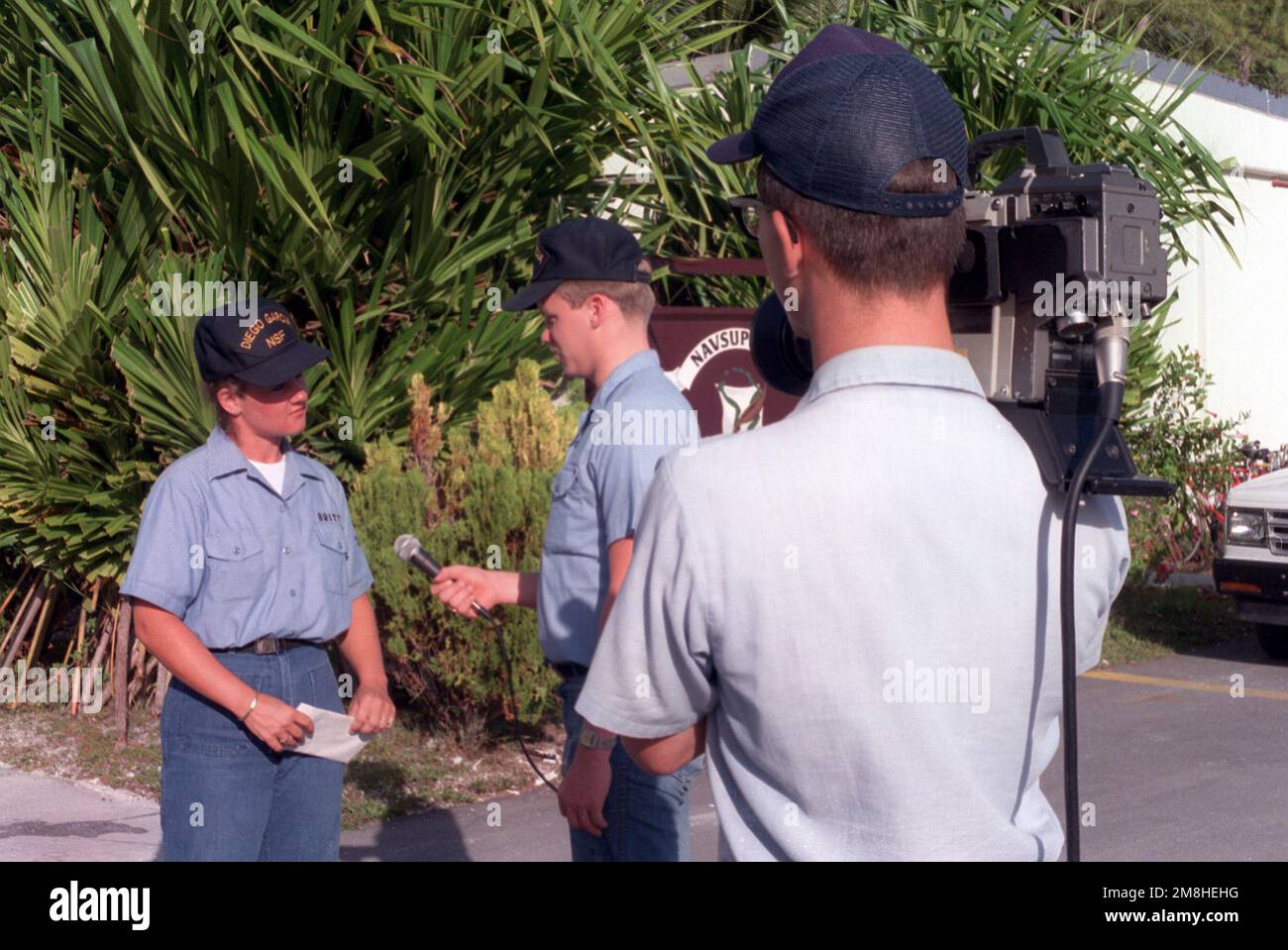Journalist Scott A. Comstock monitors audio/video signals for the Navy Broadcasting Service ...