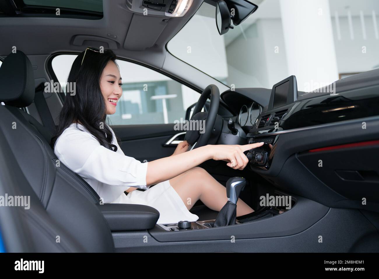 The young woman driving Stock Photo - Alamy