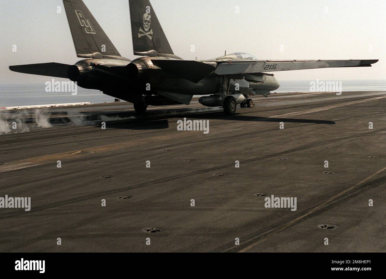 A Fighter Squadron 84 (VF-84) F-14A Tomcat aircraft accelerates down ...