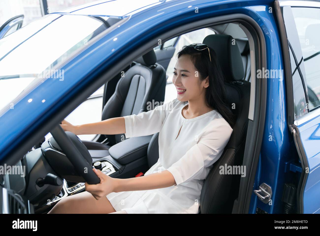 The young woman driving Stock Photo - Alamy