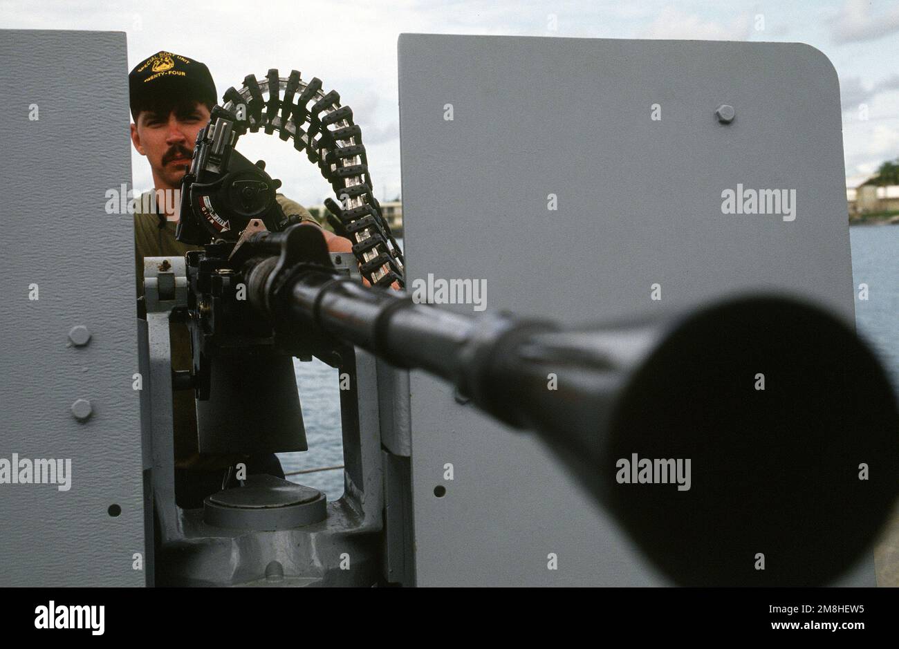 Engineman 2nd Class Jones of Special Boat Unit 24 (SBU-24) checks a ...