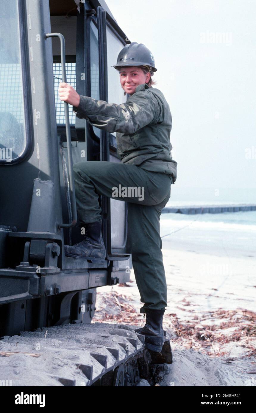 Equipment Operator Construction Apprentice Miller climbs into the cab ...