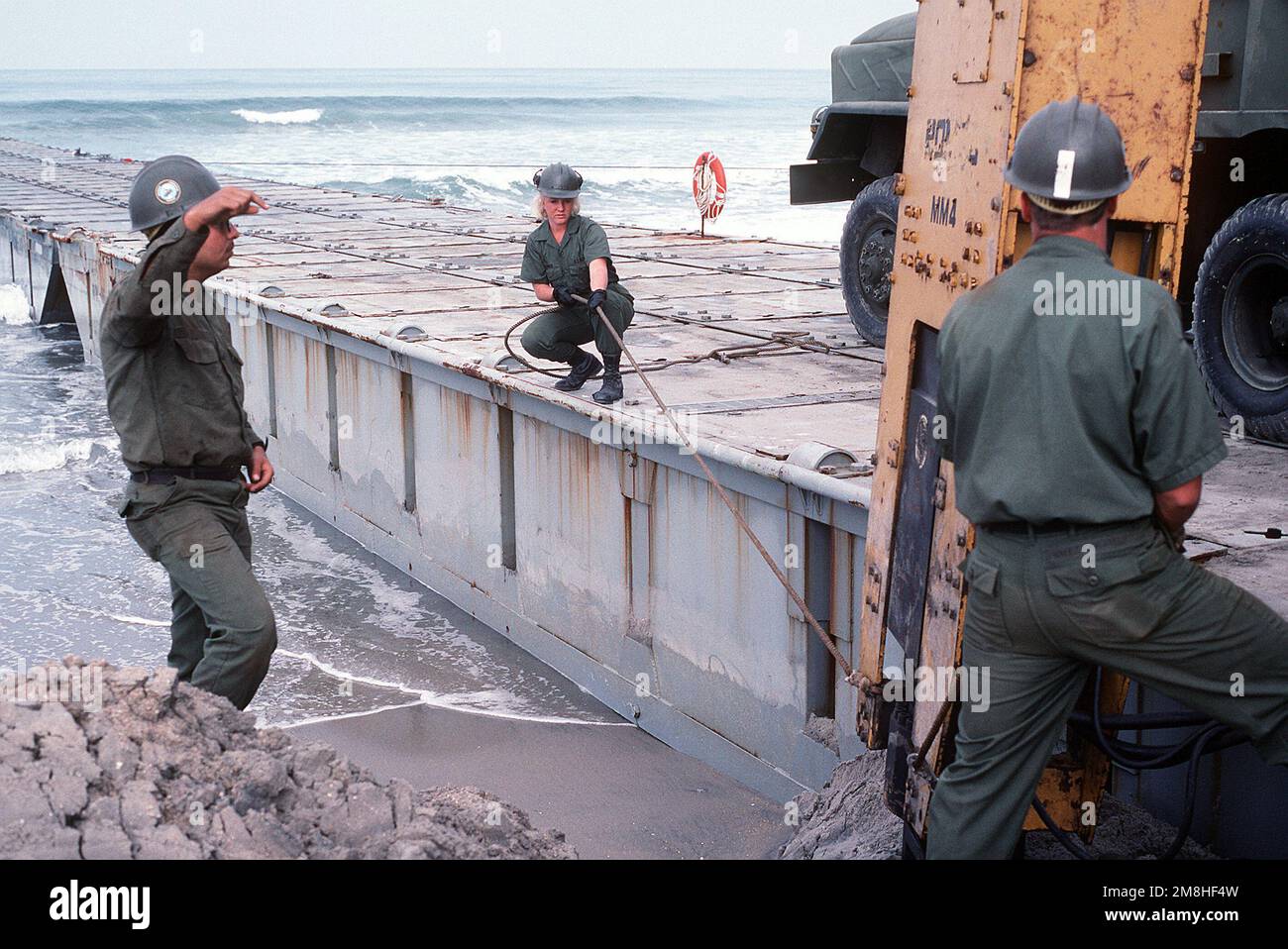 Naval Amphibious Base. Steelworker Constructionman Erica Goldman hauls ...