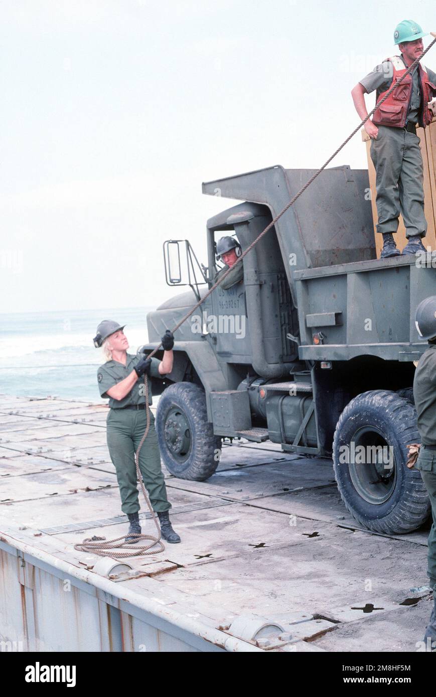Steelworker Constructionman Erica Goldman hauls on a line attached to a ...