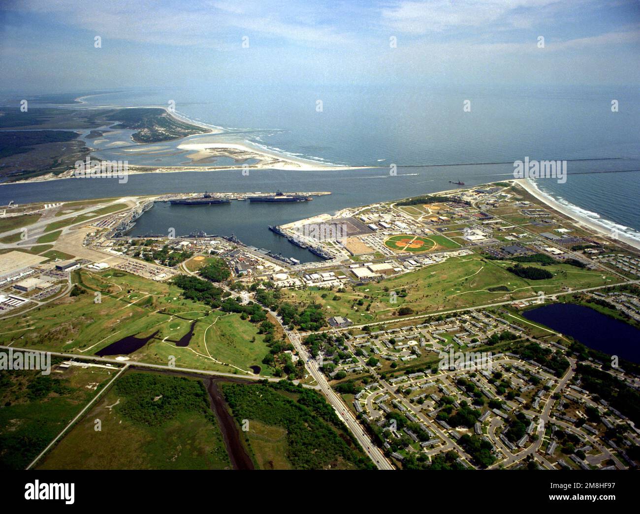A high aerial view of the Mayport Naval Station with two aircraft ...