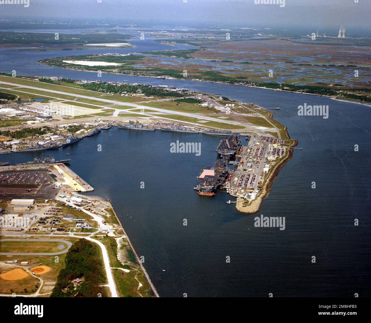 An aerial view, looking west, of the harbor at the naval station with ...