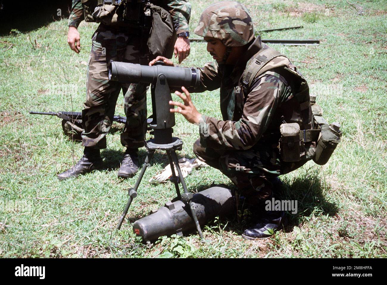 A member of Btry. R. 5th Bn., 10th Marine Regt., sets up an observation ...