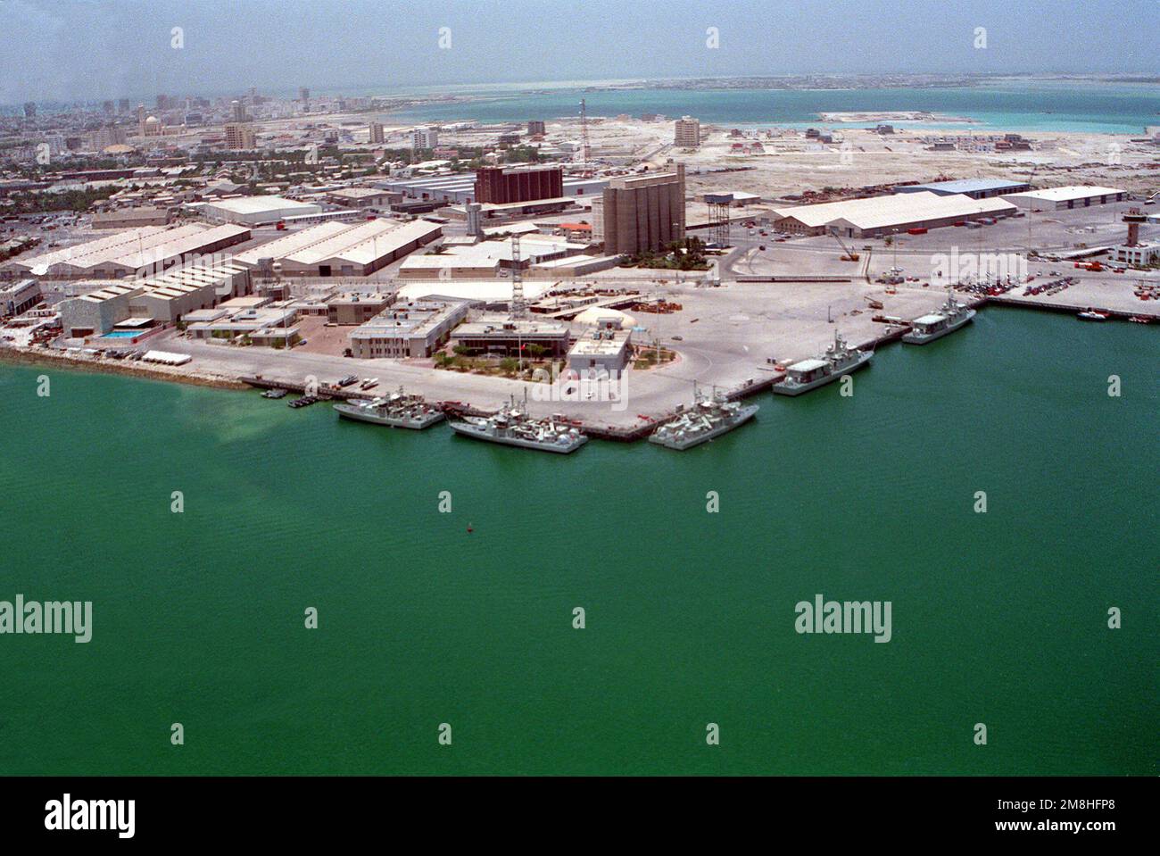 An aerial view of the naval base at Mina Sulman. Country: Bahrain (BHR ...