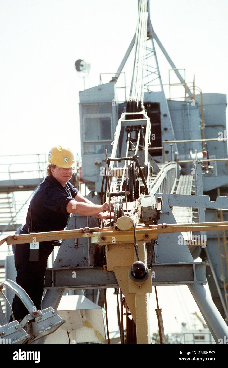 Equipment Operator 1ST Class Michelle Stiff checks the switches on a ...