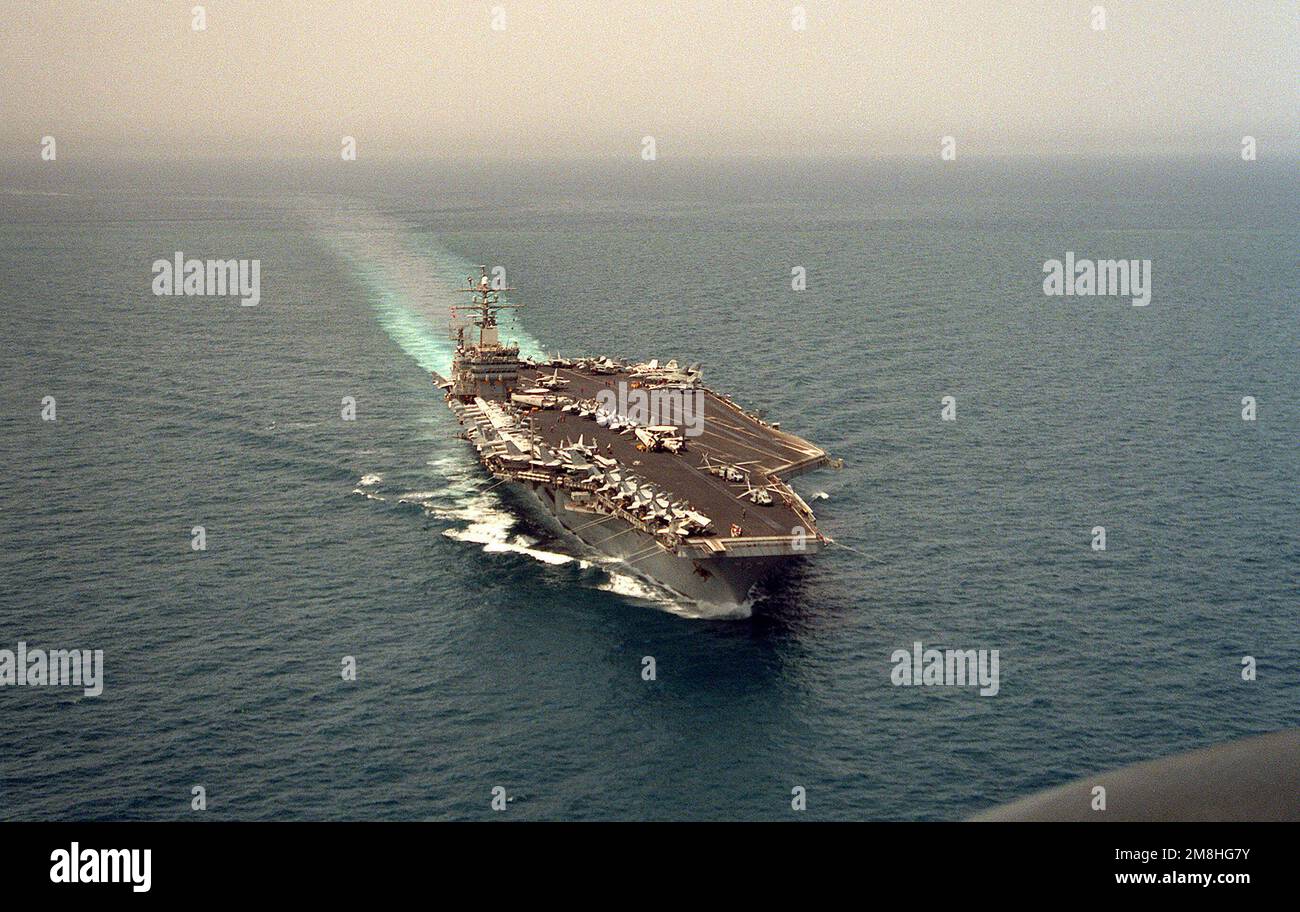 A bow view of the nuclear-powered aircraft carrier USS NIMITZ (CVN-68) underway. Base: USS ...