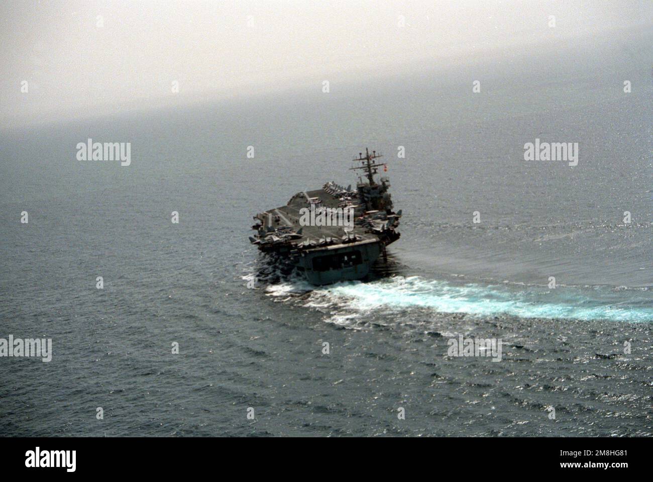 A stern view of the nuclear-powered aircraft carrier USS NIMITZ (CVN-68 ...