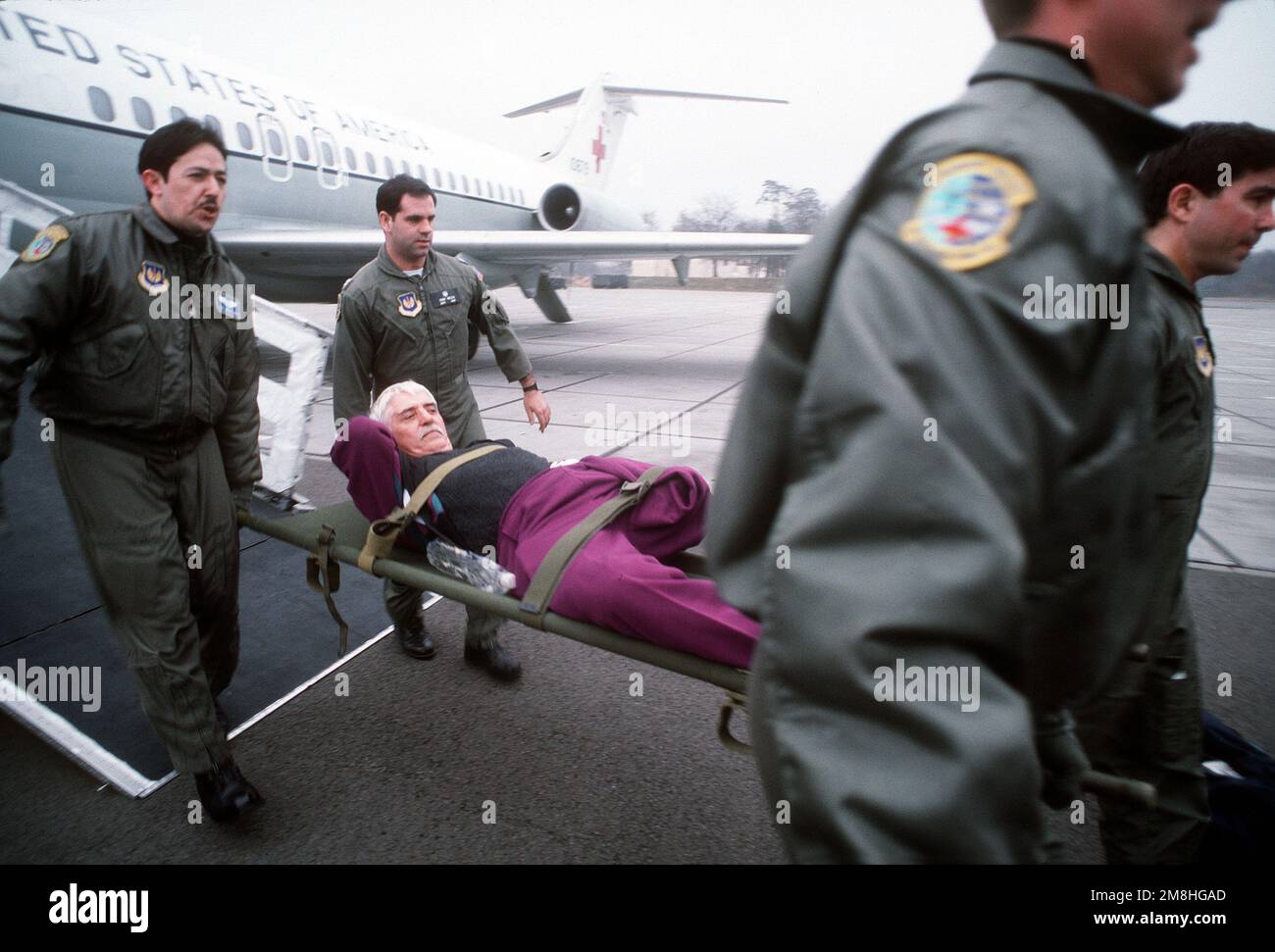 Crew members from the 55th Aeromedical Airlift squadron carry a patient ...