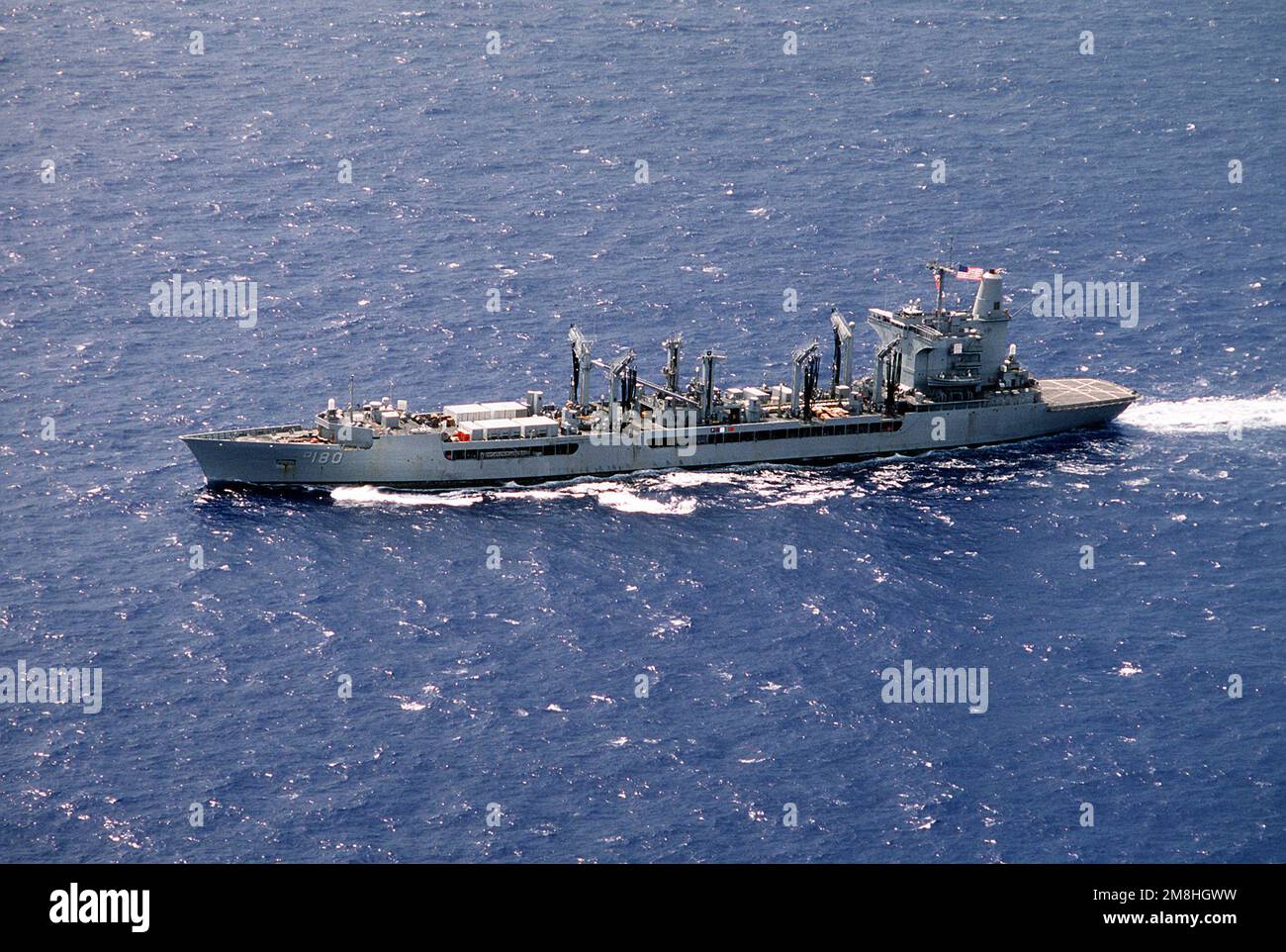 An aerial port side view of the fleet oiler USS WILLIAMETTE (AO-180 ...