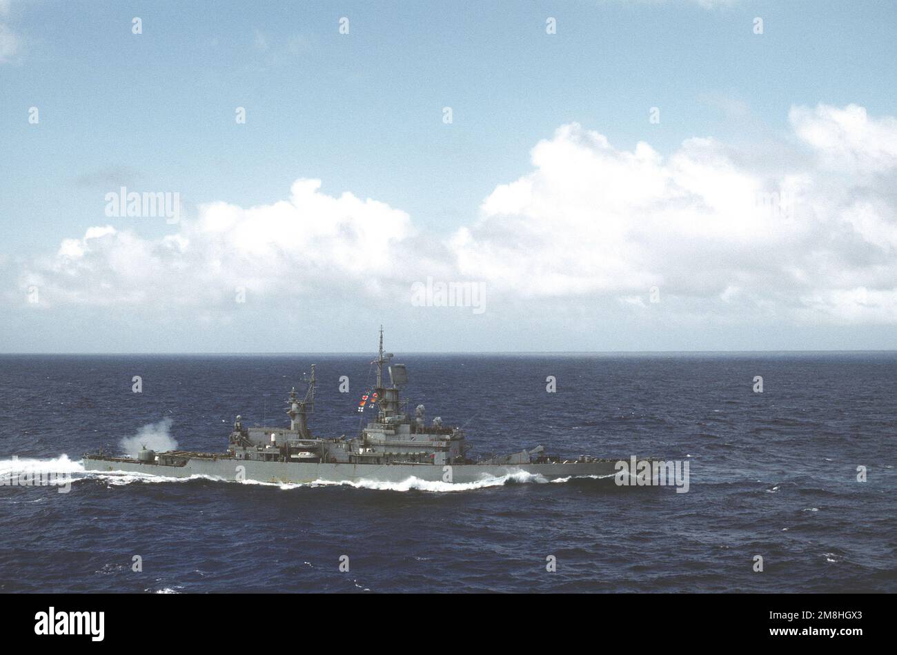 A starboard side view of the guided missile cruiser USS FOX (CG-33 ...