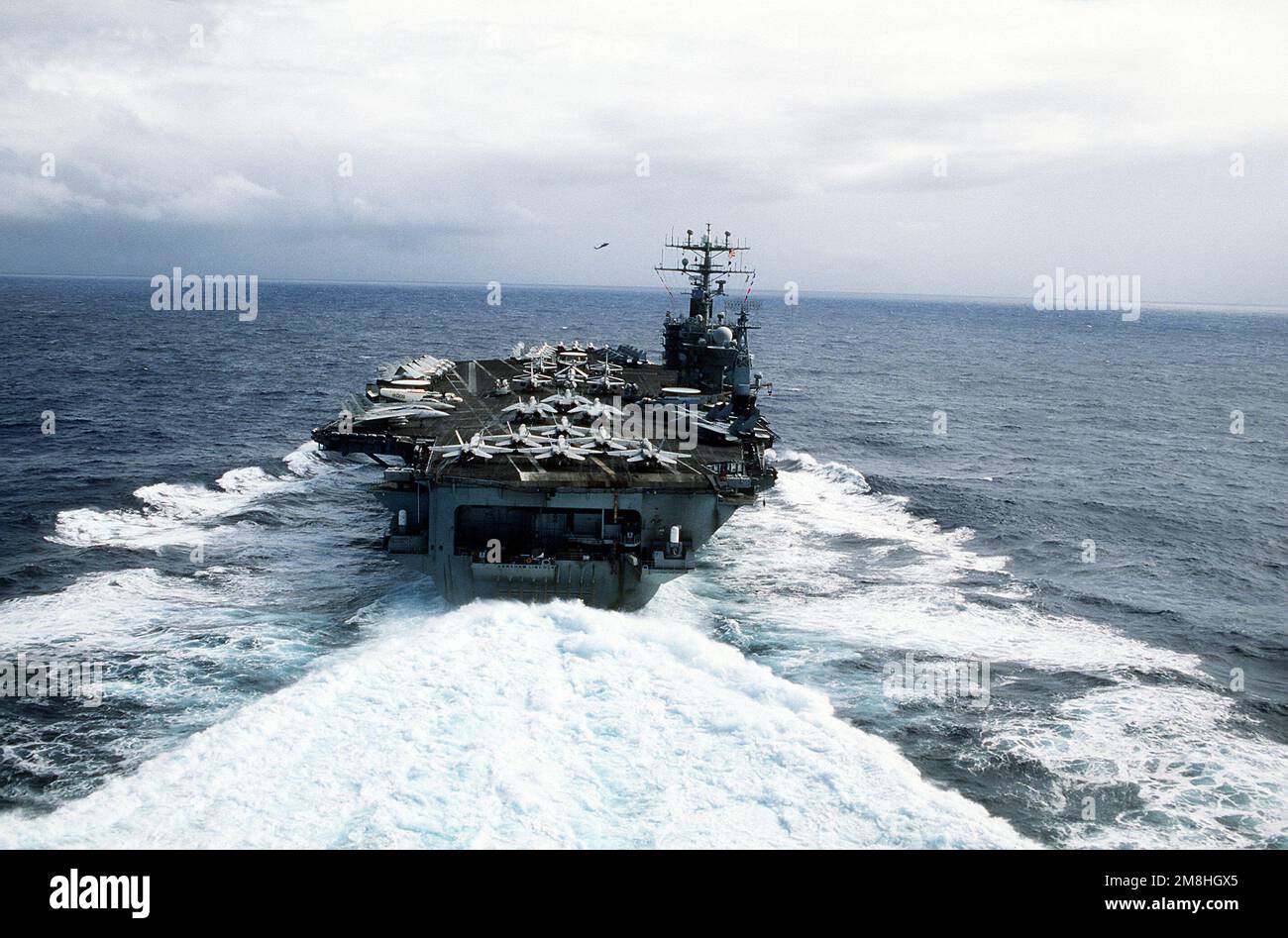 An aerial stern-on view of the nuclear-powered aircraft carrier USS ...