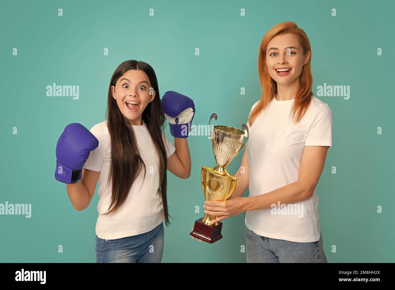 Teenager boxer winner boxing. Mommy and teenager child daughter holding ...