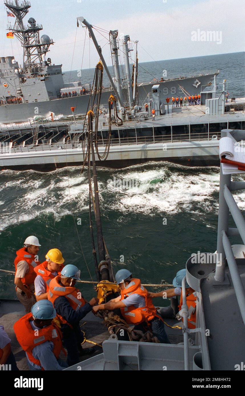 Crewmen aboard the guided missile frigate USS DOYLE (FFG-39) secure a ...