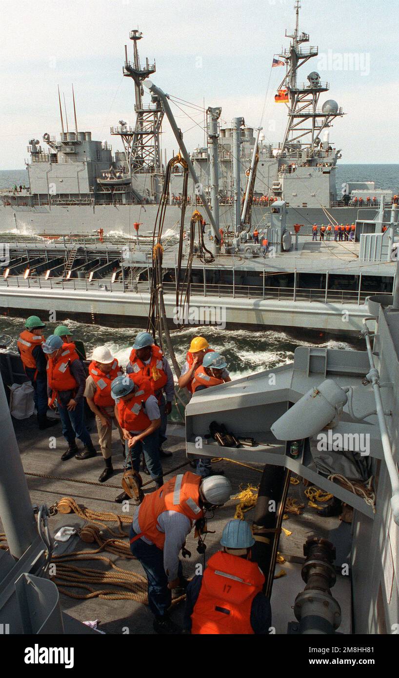 Crewmen aboard the guided missile frigate USS DOYLE (FFG-39) secure a ...
