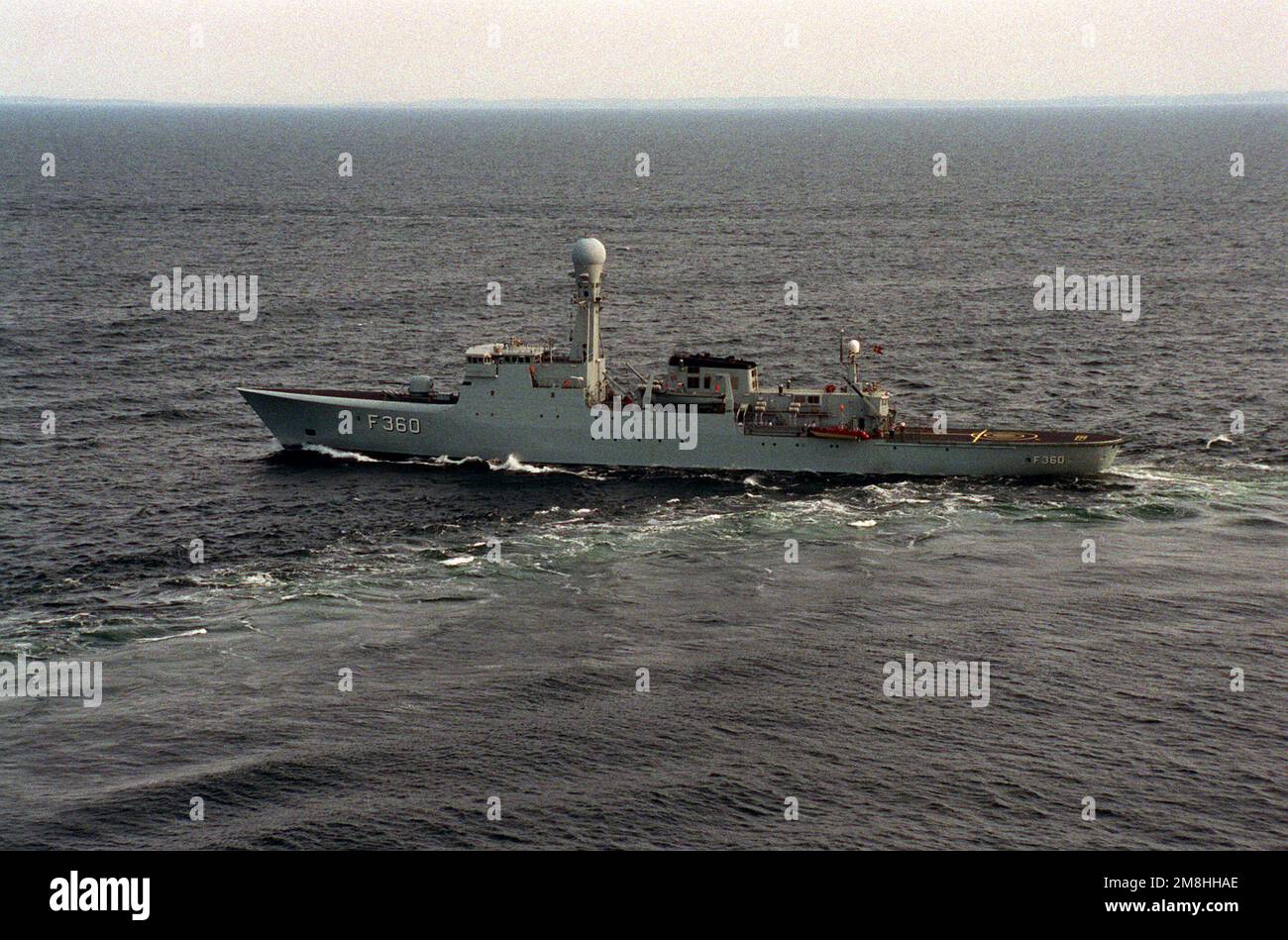 A port beam view of the Danish frigate HDMS VAEDDEREN (F-360) underway ...