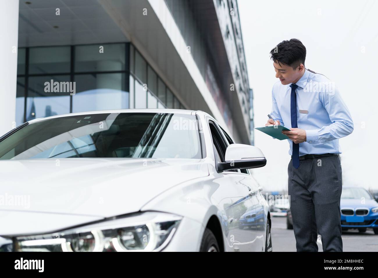 Business young men work in 4 s shop Stock Photo - Alamy