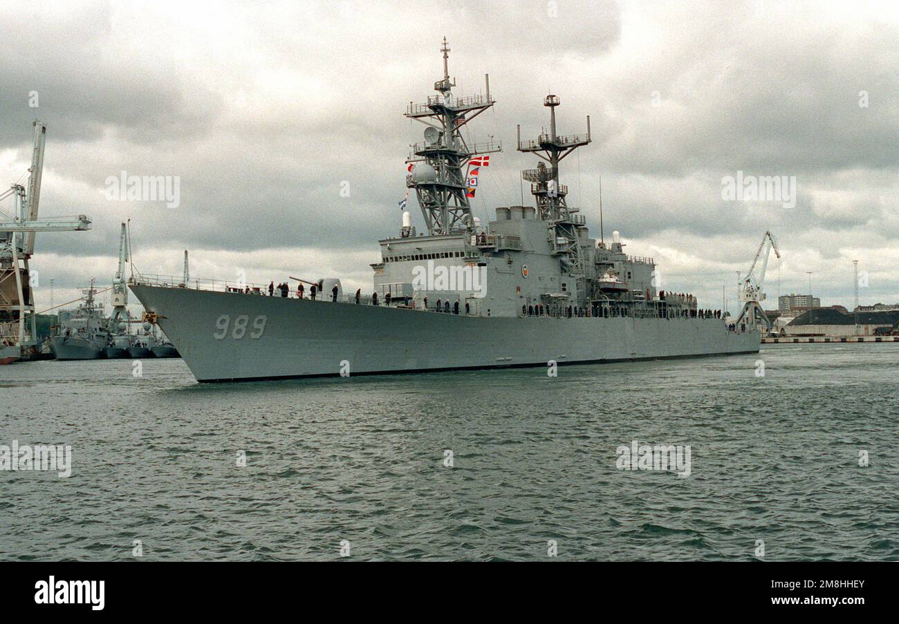 A port bow view of the destroyer USS DEYO (DD-989) entering port during ...