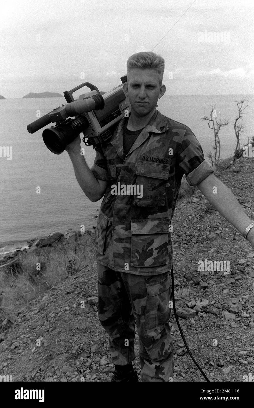 CPL. Paul S. Royston, a Marine Corps Combat Cameraman, with camera on ...