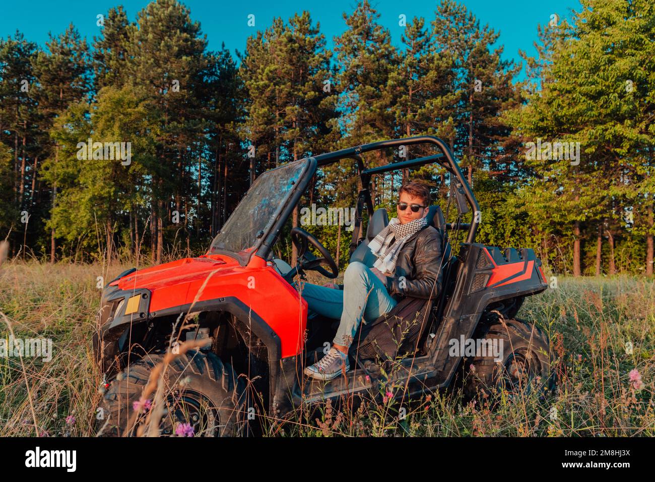 Portrait of young happy excited man enjoying beautiful sunny day while ...