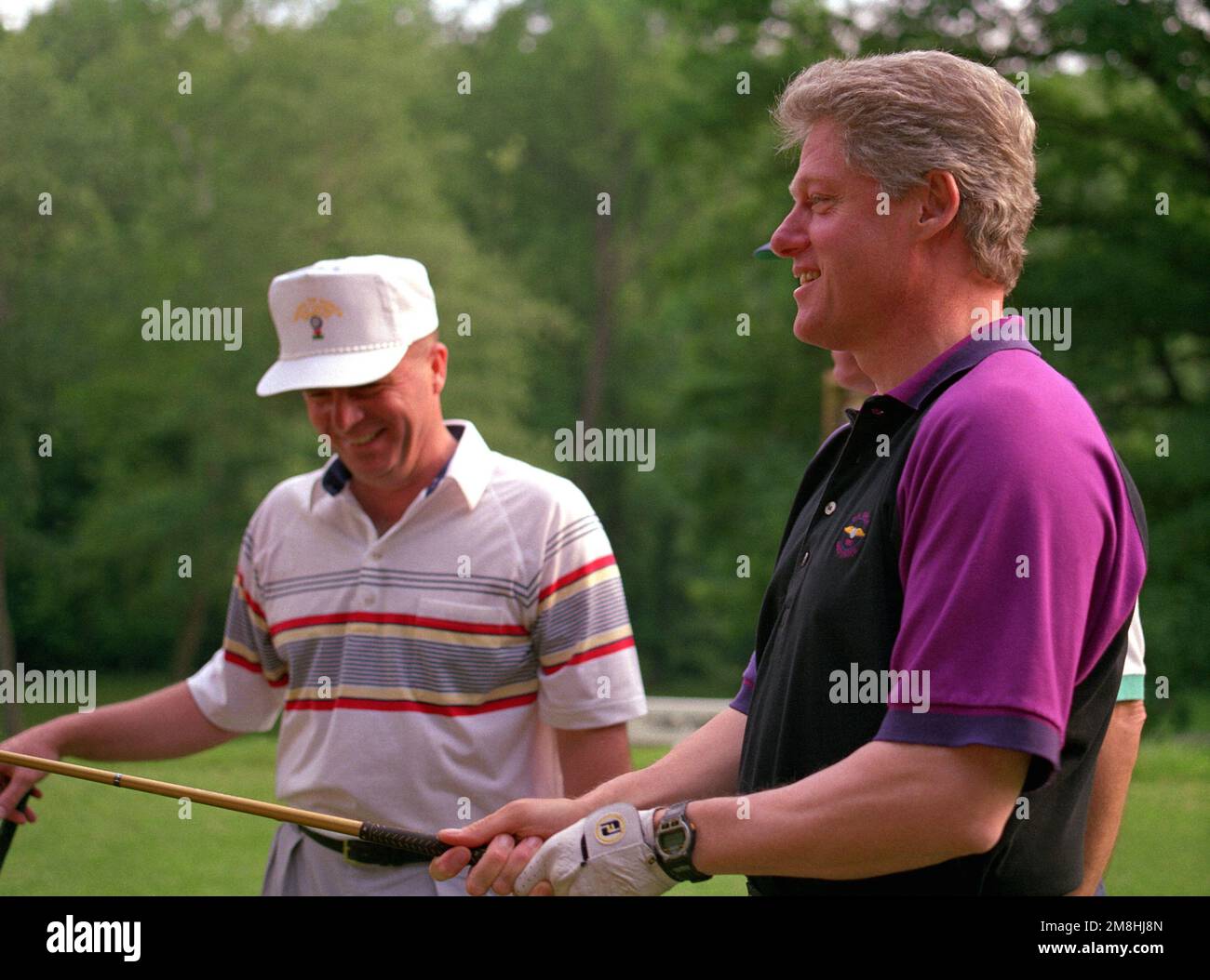 President William Jefferson Clinton, on the golf course, enjoys a laugh ...