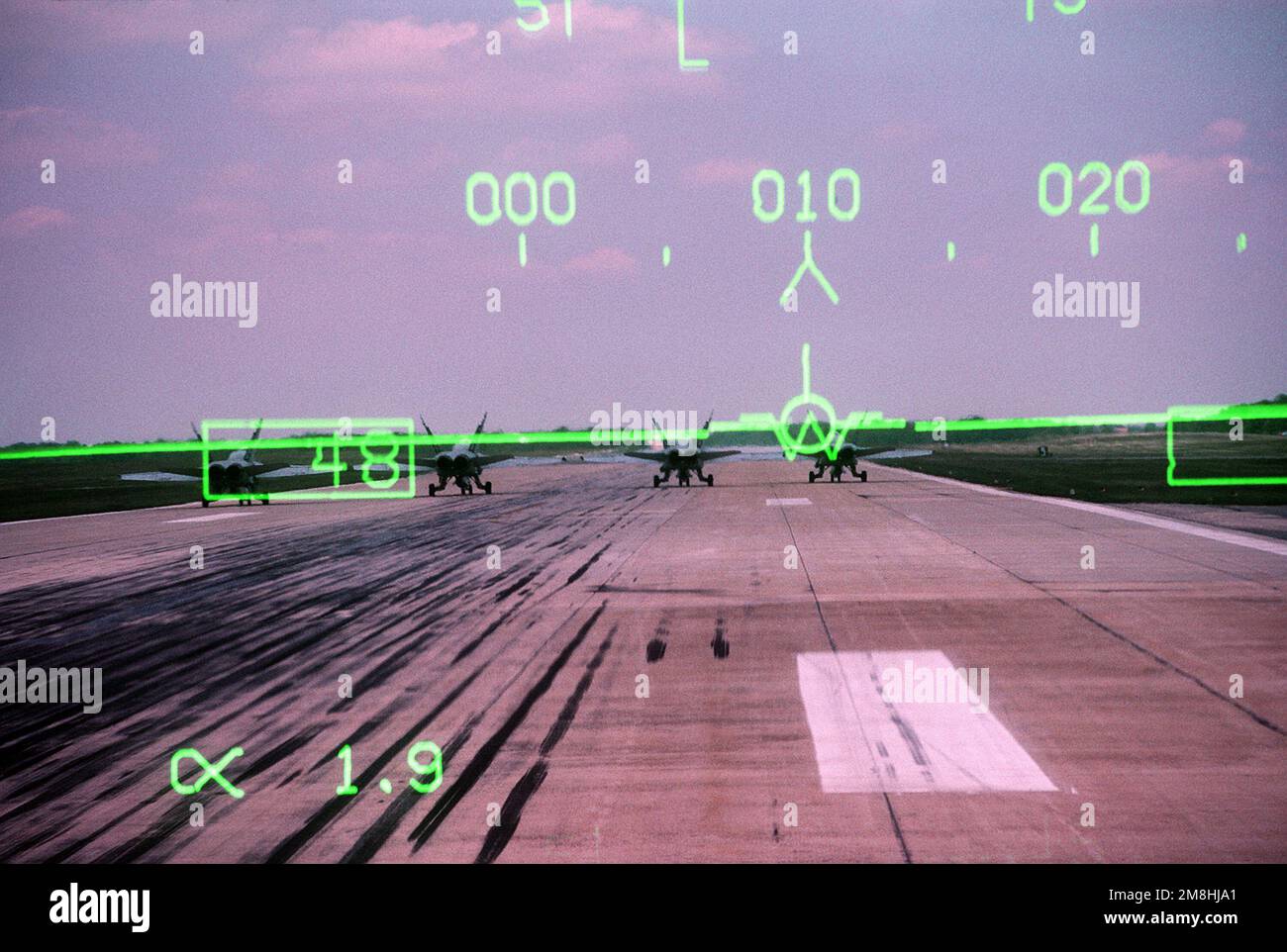 Information from the Head-Up Display (HUD) is superimposed in the pilot ...