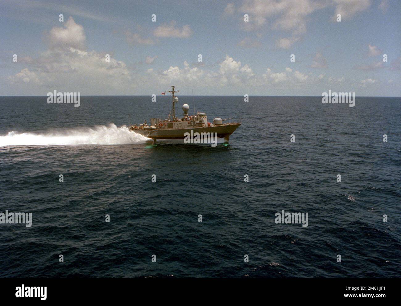 A starboard beam view of the USS HERCULES (PHM-2), a hydrofoil with ...