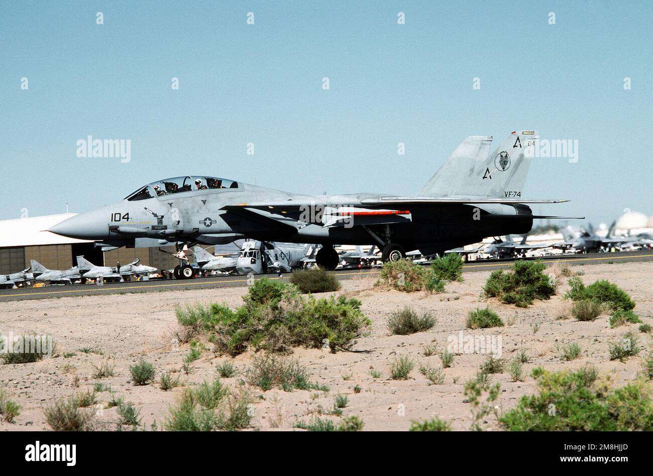 A Fighter Squadron 74 (VF-74) F-14B Tomcat aircraft taxis to the runway ...