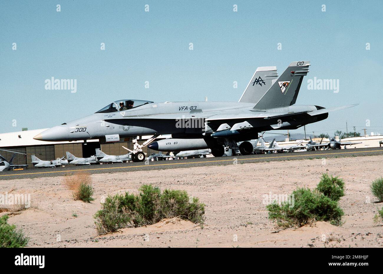 A Strike Fighter Squadron 83 (VFA-83) F/A-18C Hornet aircraft loaded ...