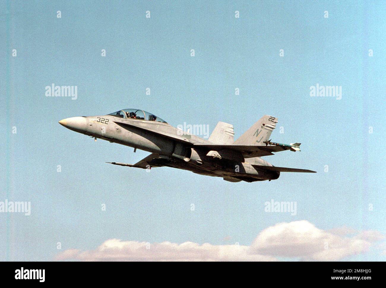 A Strike Fighter Squadron 125 (VFA-125) F/A-18D Hornet aircraft flies ...