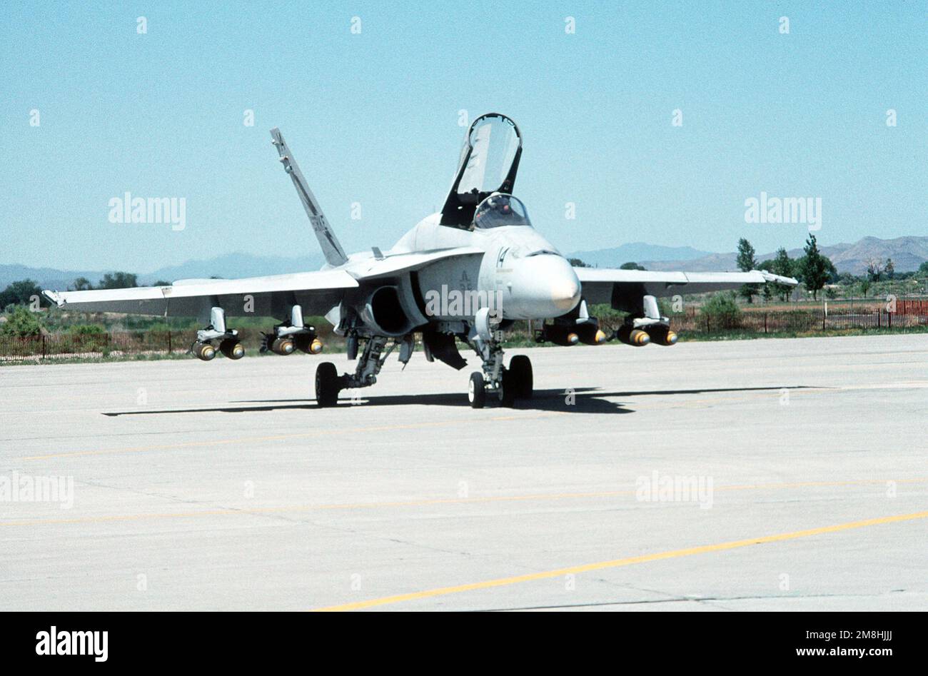 An F/A-18A Hornet aircraft of the Naval Strike Warfare School taxis out ...